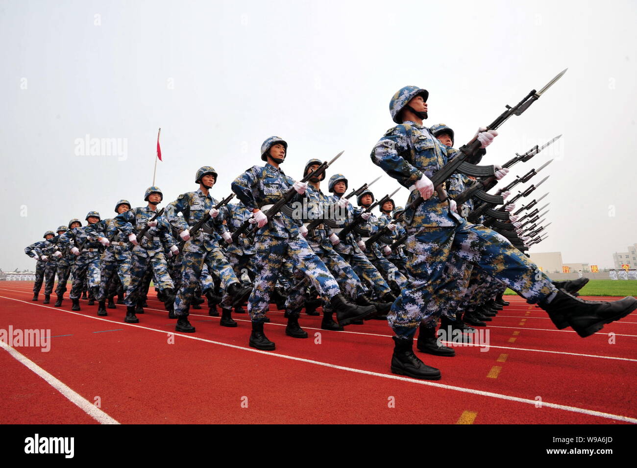 Chinese PLA Navy soldiers parade during a ceremony celebrating the 50th ...