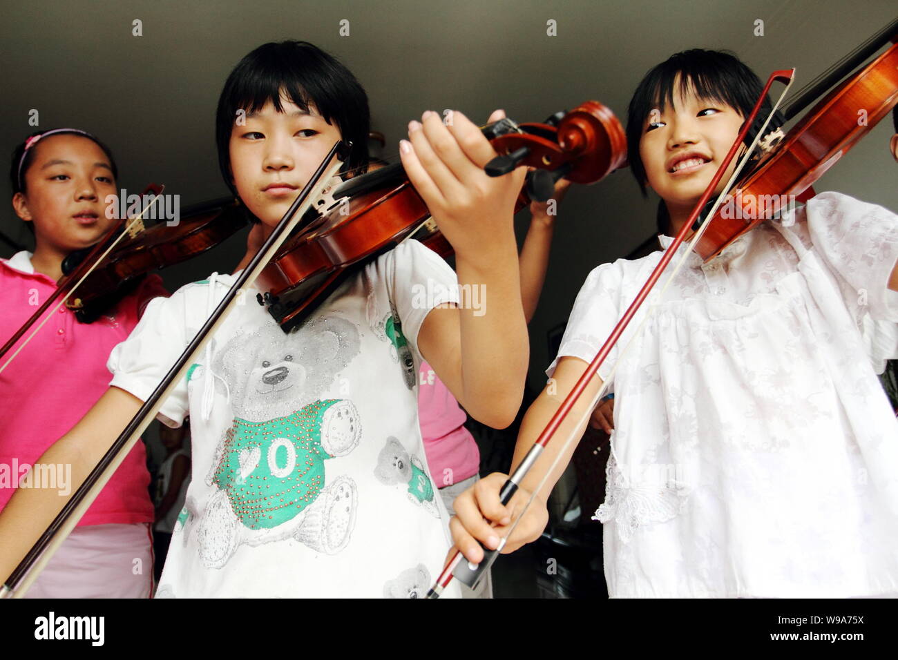 Chinese kids learn playing violin in Donggaocun town, Pinggu District ...