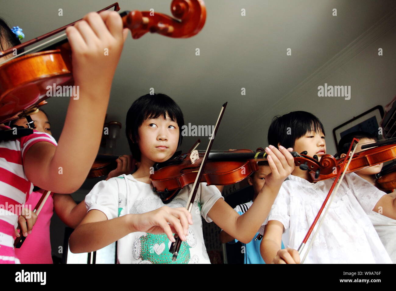 Chinese kids learn playing violin in Donggaocun town, Pinggu District ...