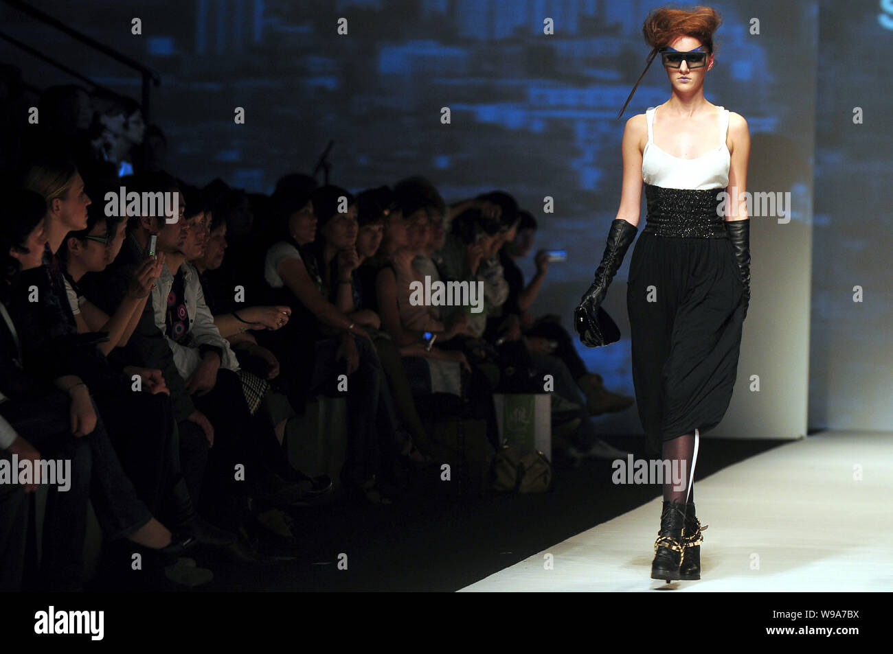 A model parades to show the new collections in the Seven Days fashion ...