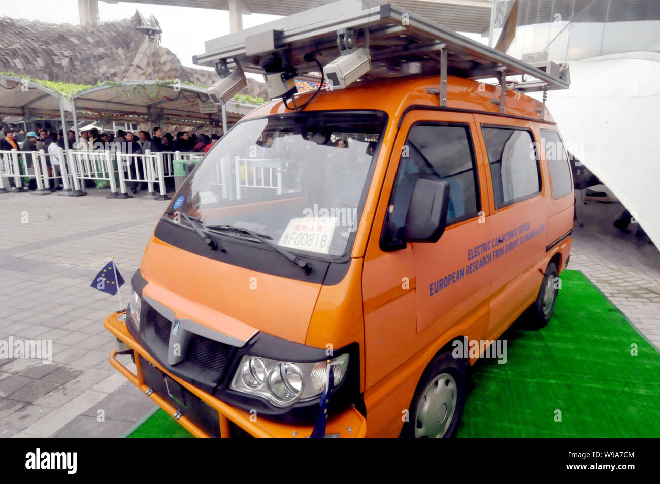 A solar-powered driverless vehicle from Italy is displayed outside the ...