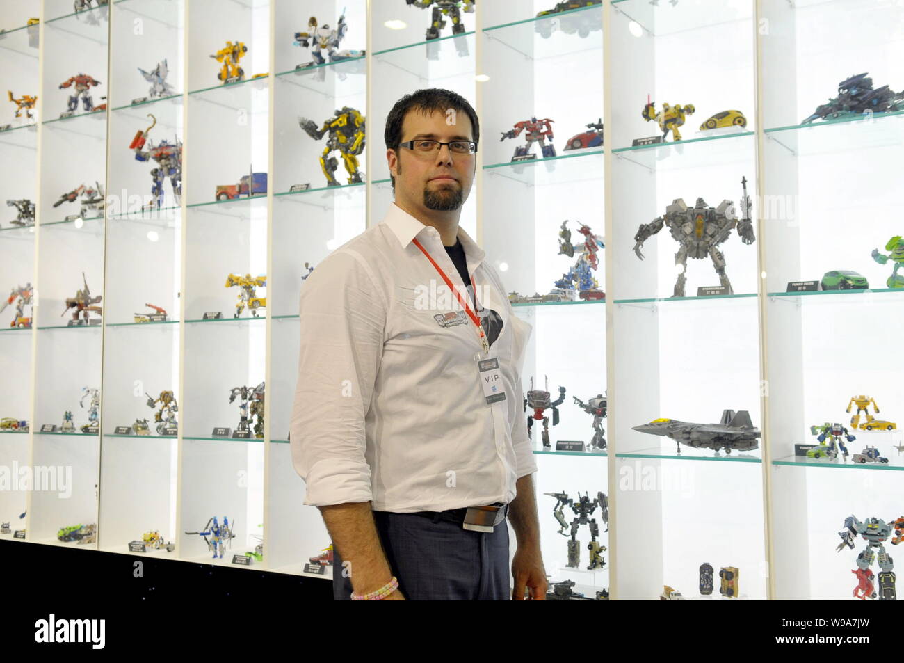 Designer Michelino Paolino of Hasbro Design poses in front of models of ...