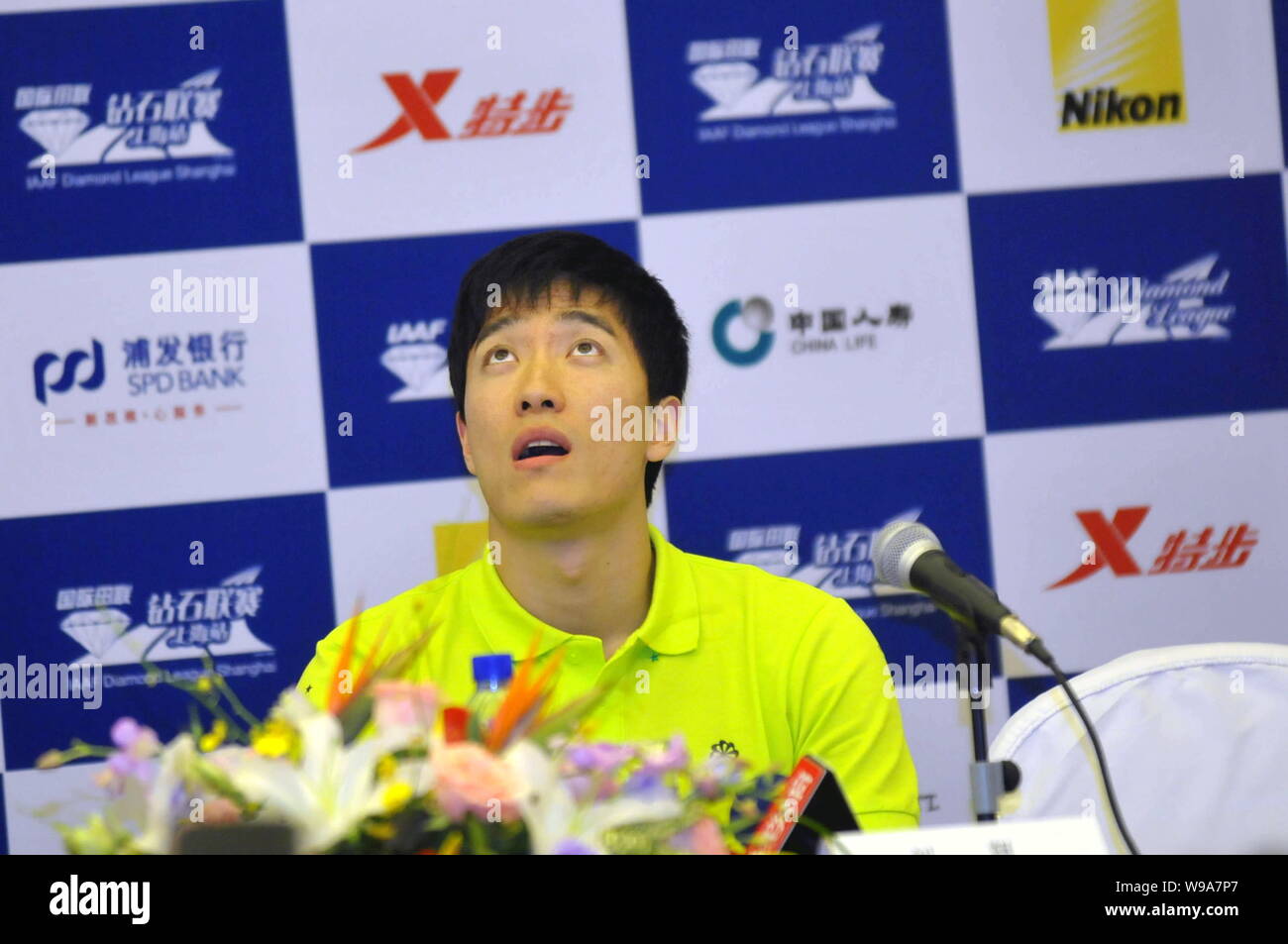 Chinese star hurdler Liu Xiang is seen during a press conference for ...