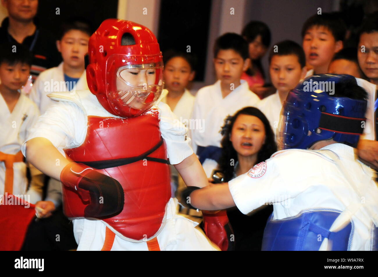 Two kids fight during a juvenile karate competition in Shanghai, China ...