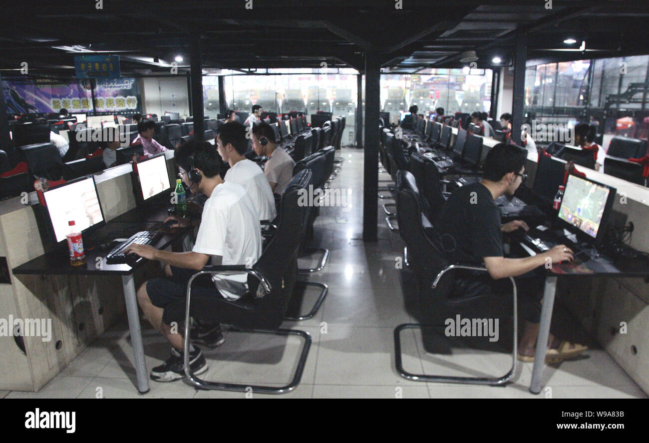 Chinese Netizens are seen at an Internet cafe in Beijing, China, July ...