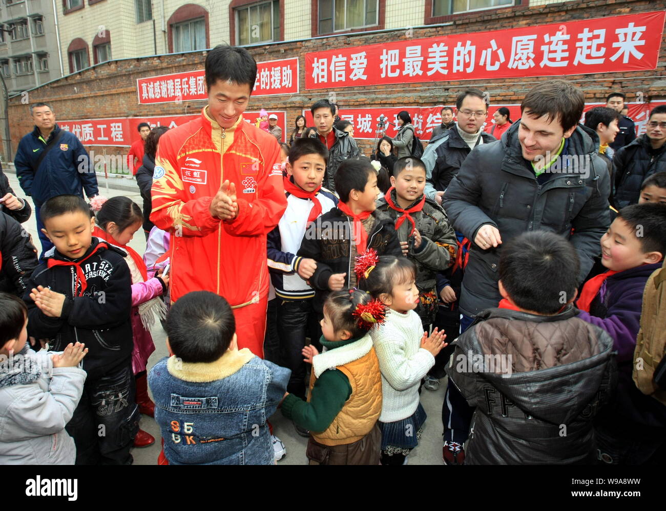 Chinese table tennis player Wang Liqin, front left, and German table ...