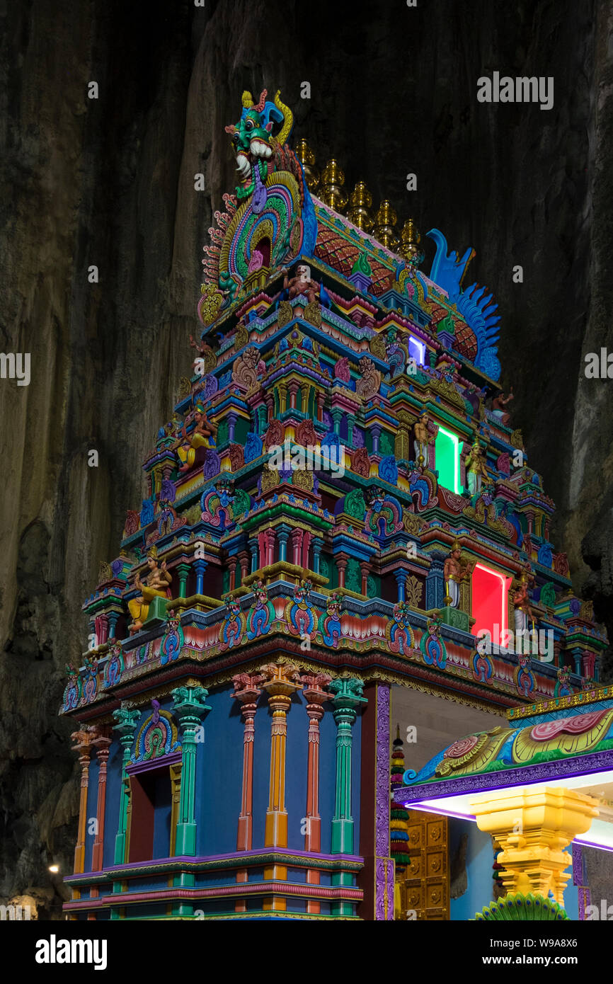 The beautiful, lit gopuram of the temple inside Batu Caves in Kuala ...