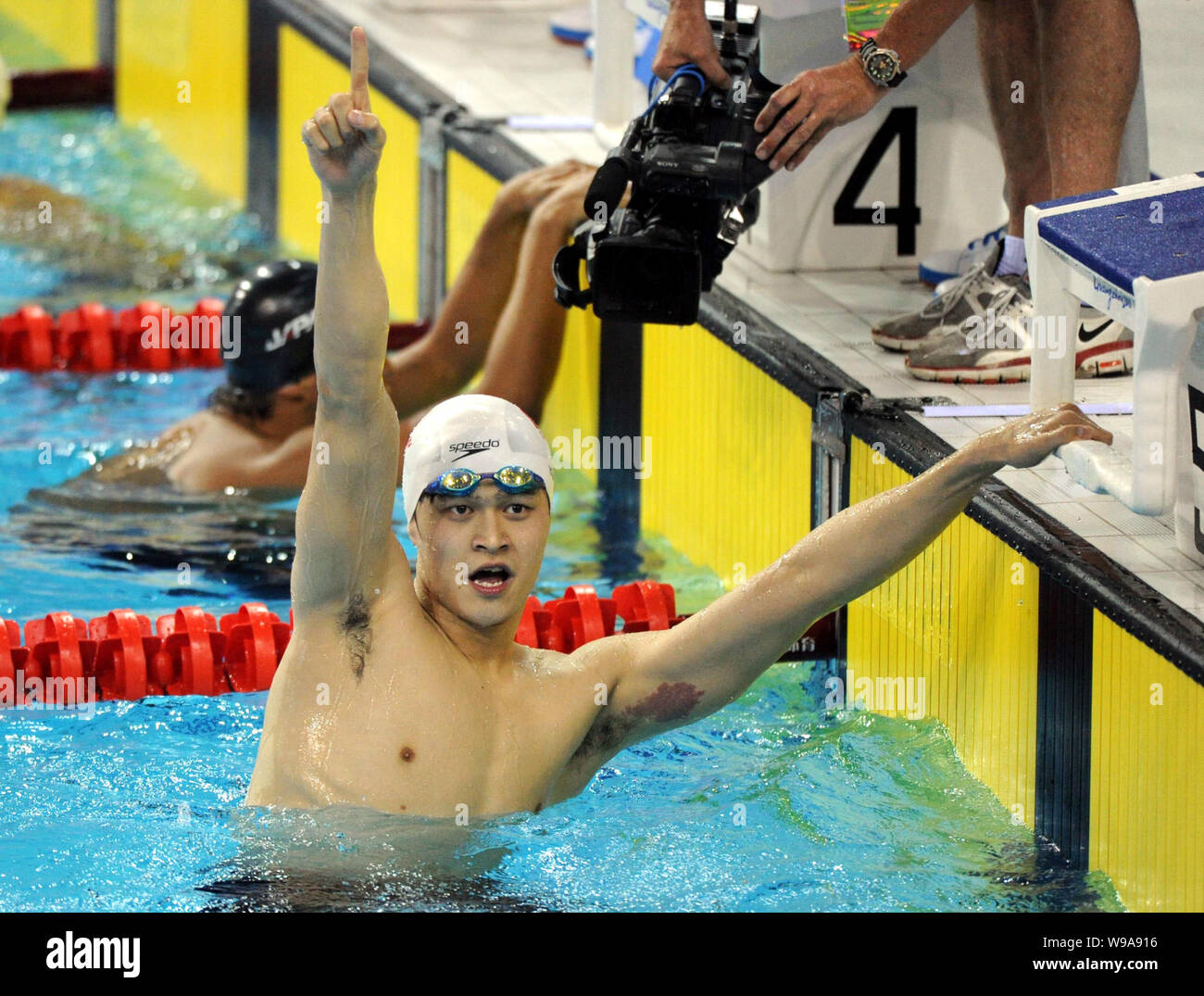 Chinas Sun Yang celebrates in the pool after winning the mens 4x200m ...