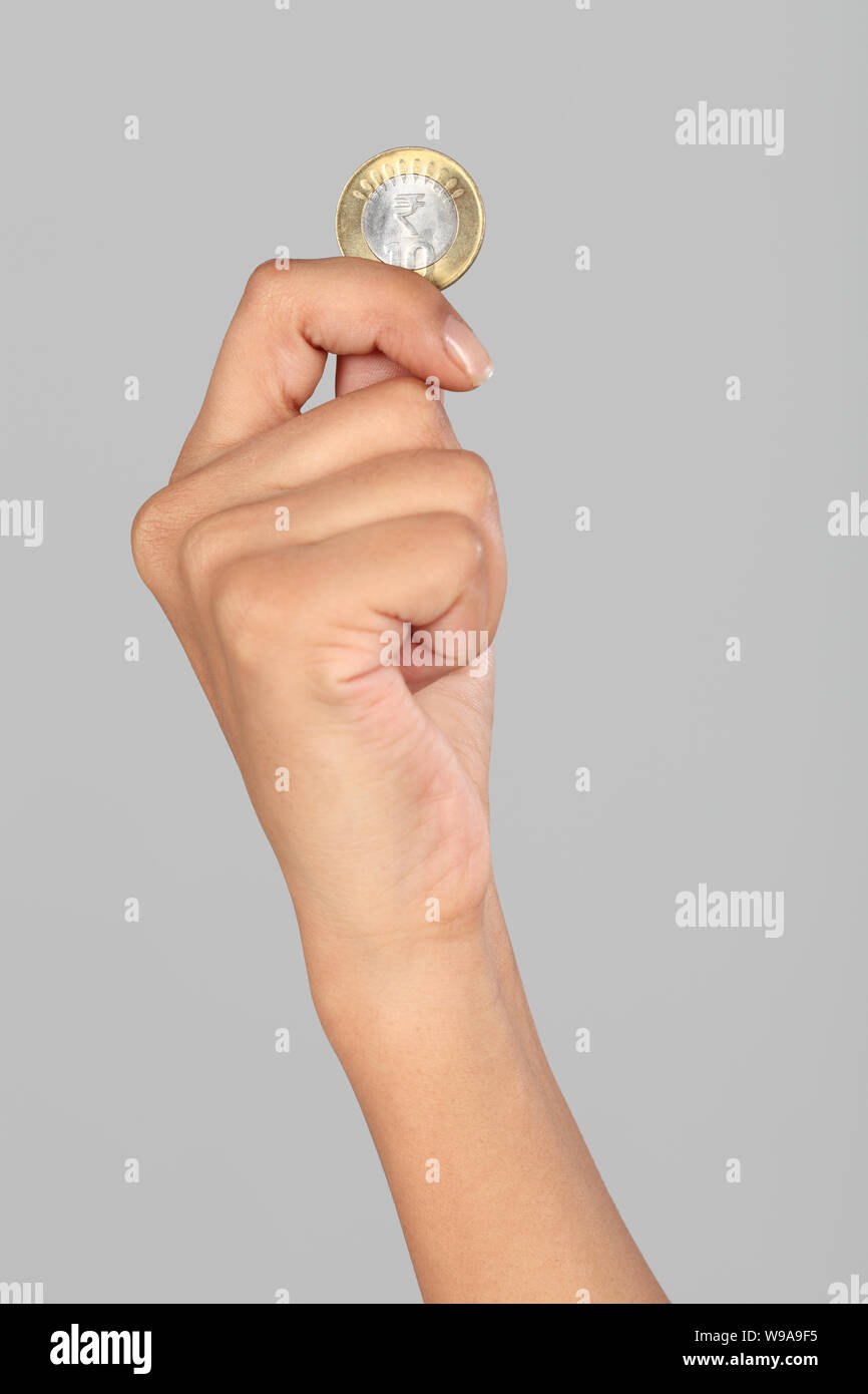 Close up of a person's hand showing Indian coin Stock Photo - Alamy