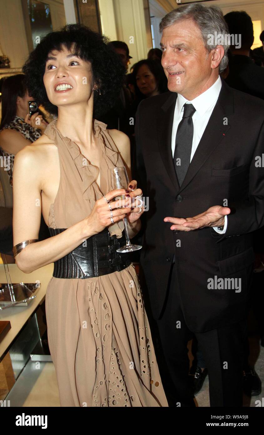 Hong Kong actress Maggie Cheung (L) and Dior CEO Sidney Toledano visit ...