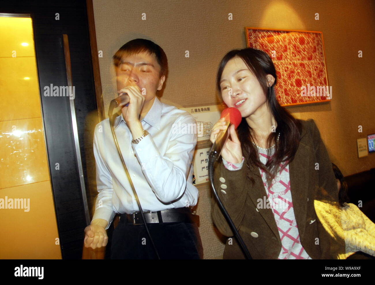 --FILE--Young Chinese people sing in a KTV bar in Beijing, China, 12 ...