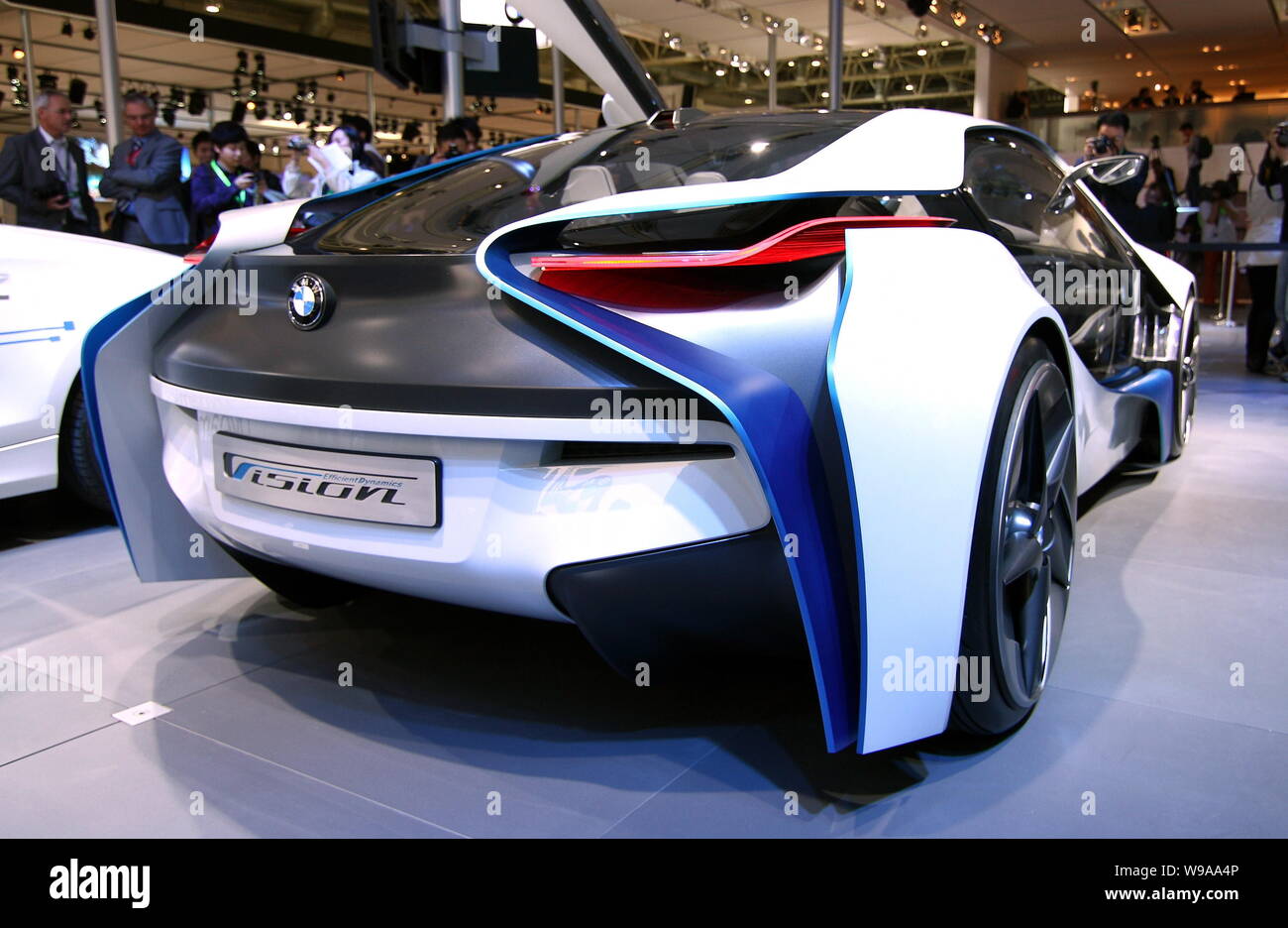 Visitors look at the BMW Vision EfficientDynamics during the 11th ...