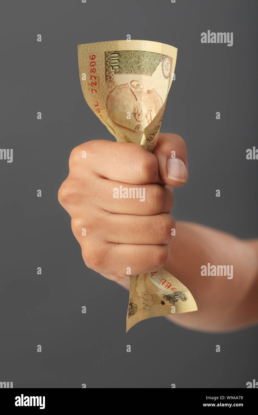 Squeezing Money High Resolution Stock Photography and Images - Alamy