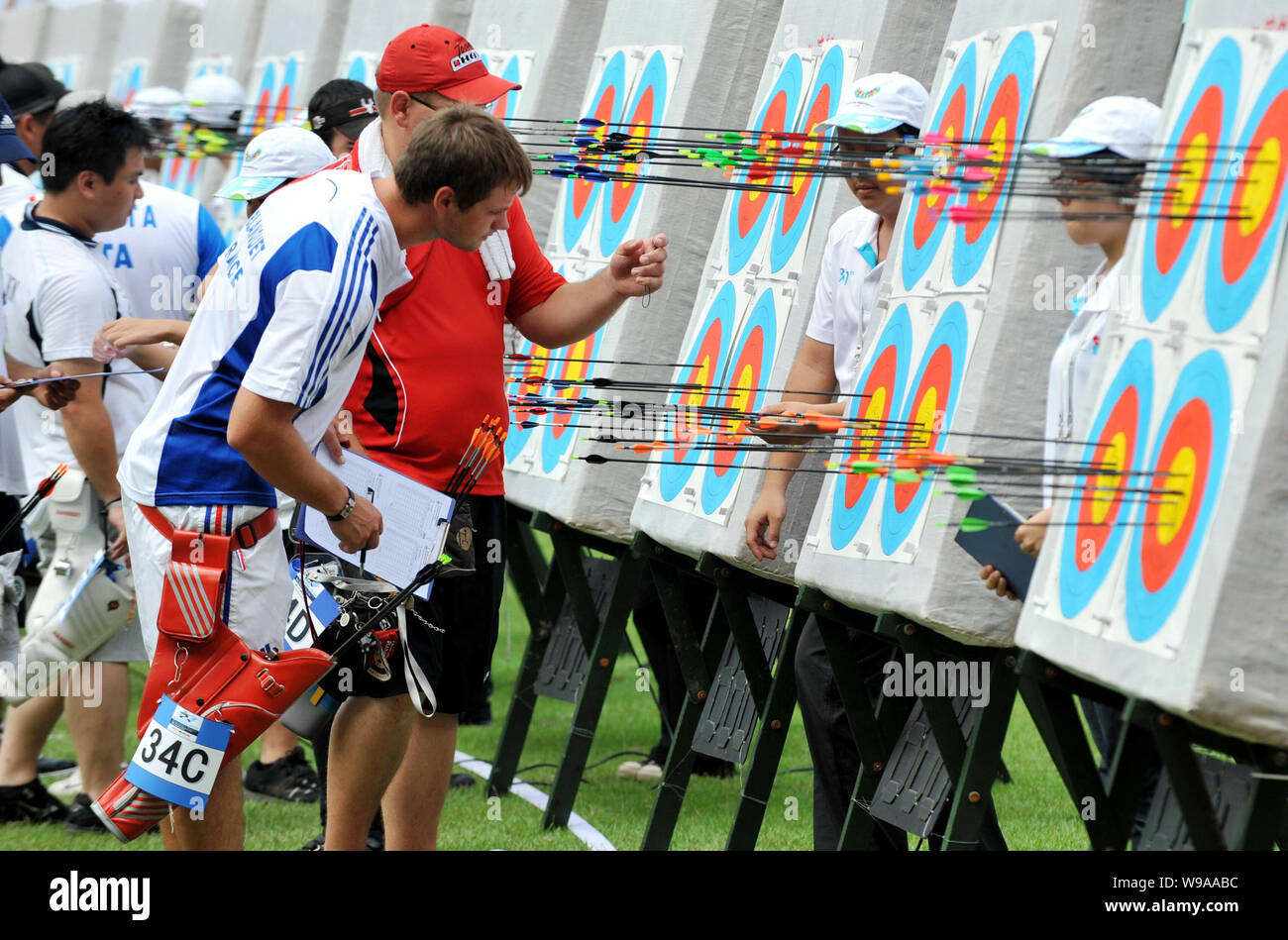 Participats check their scores during the first-day competition of the ...