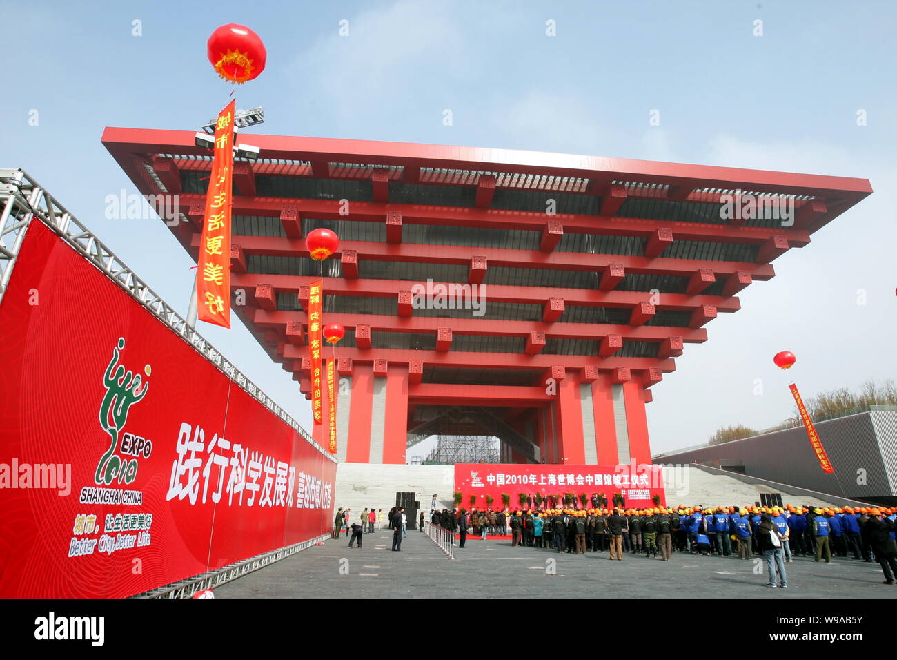 Chinese construction workers and visitors are seen during the ...