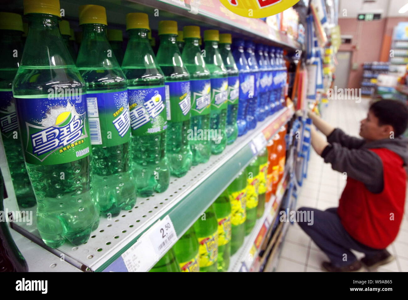 Bottles of Sprite drink of Coca-Cola are seen for sale at a supermarket ...