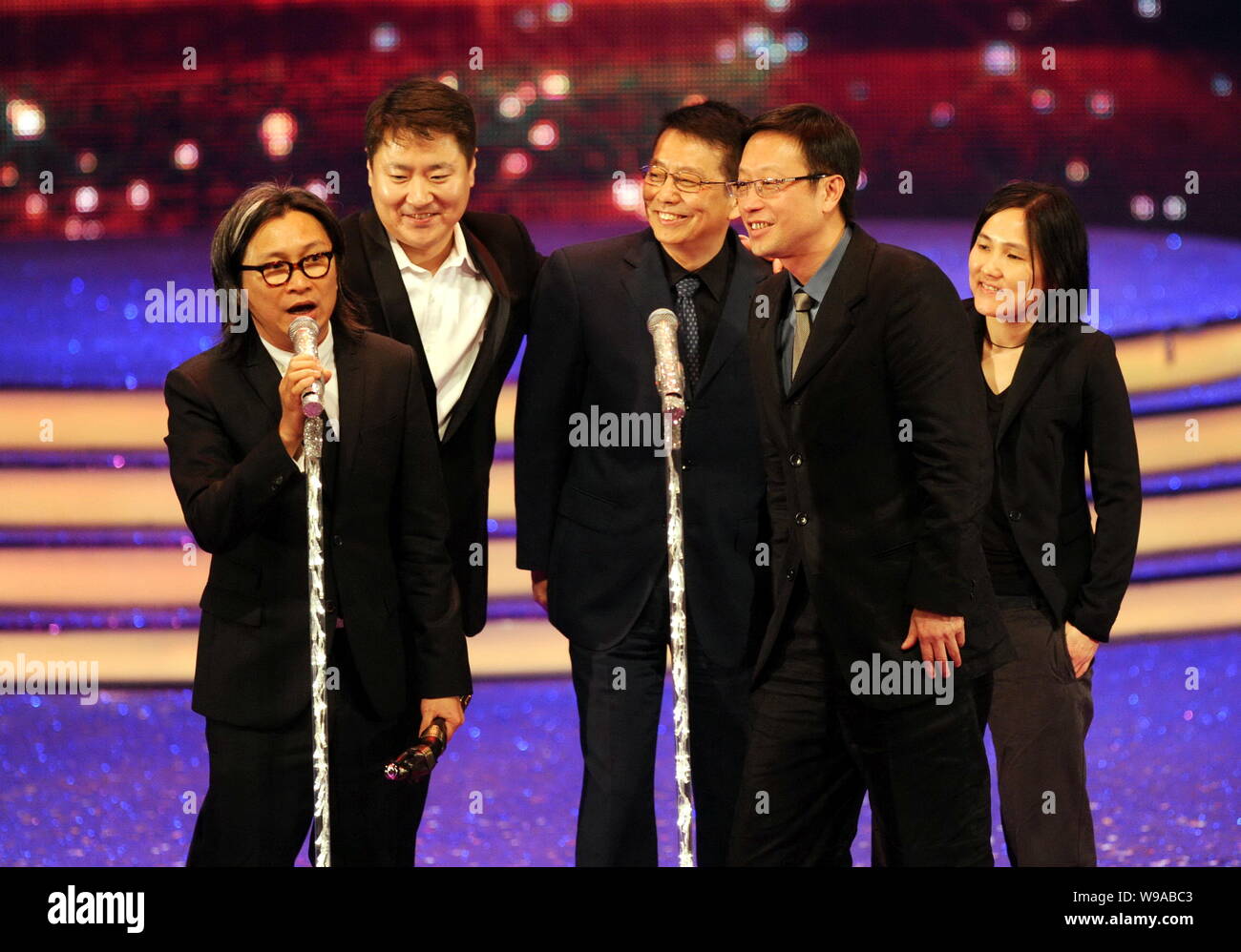 Hong Kong director and producer Peter Chan (L1) speaks after his film ...