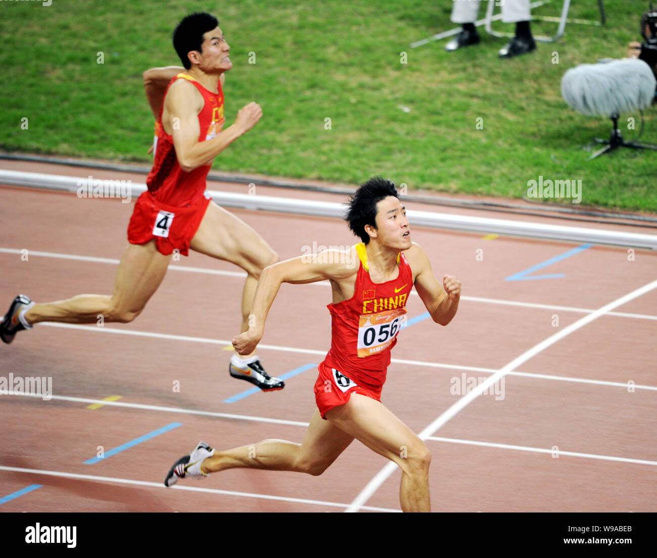 Chinas star hurdler Liu Xiang, front, dashes to the line in the mens 110m hurdles final at the ...