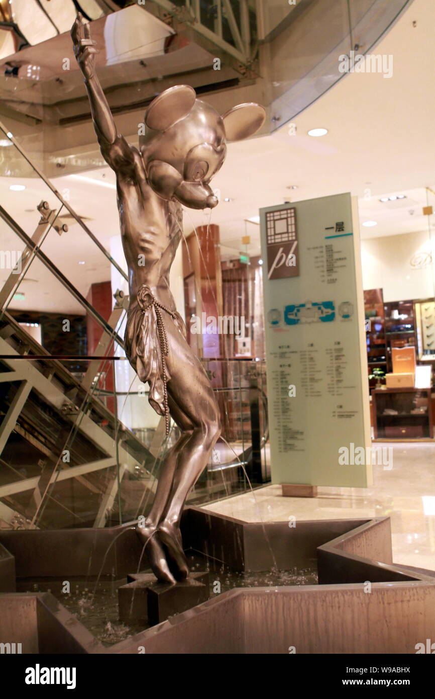 A crucified Mickey Mouse statue is seen in the Yintai shopping mall in ...