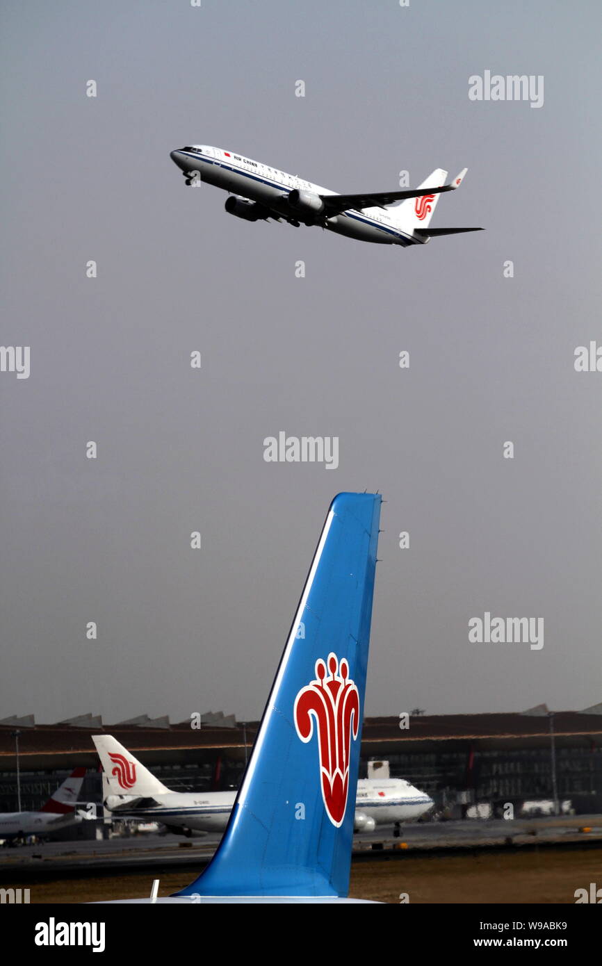 Planes of Air China are seen taking off and preparing to take off while ...