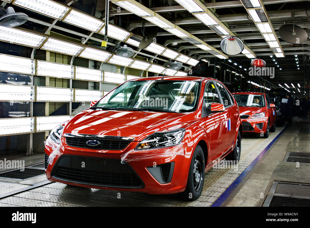 --FILE--Ford Focus cars pass through the assembly line in the auto ...