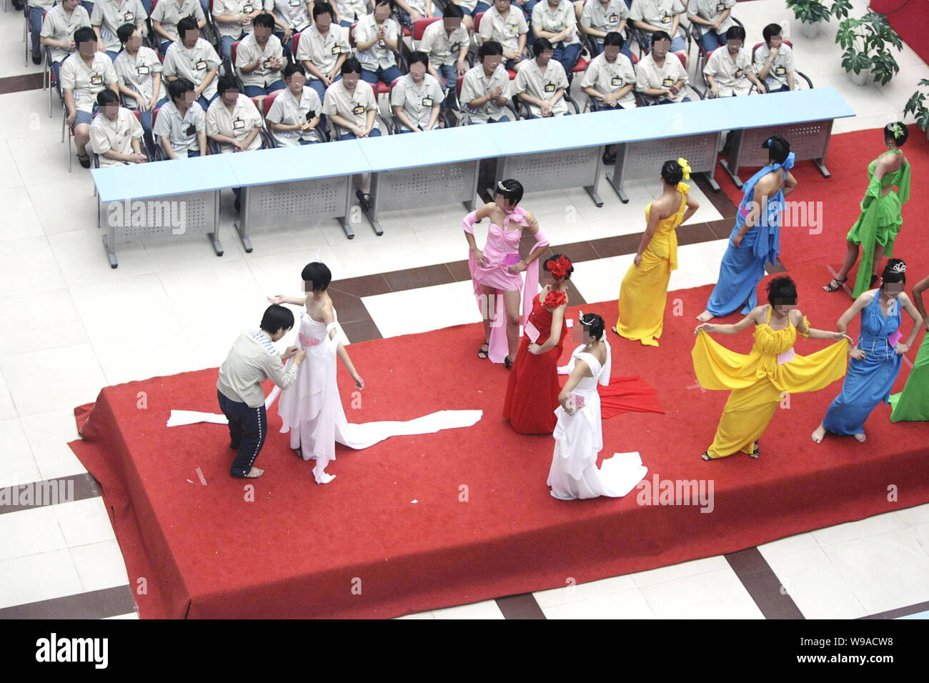 Chinese female inmates parade during a fashion show featuring low ...