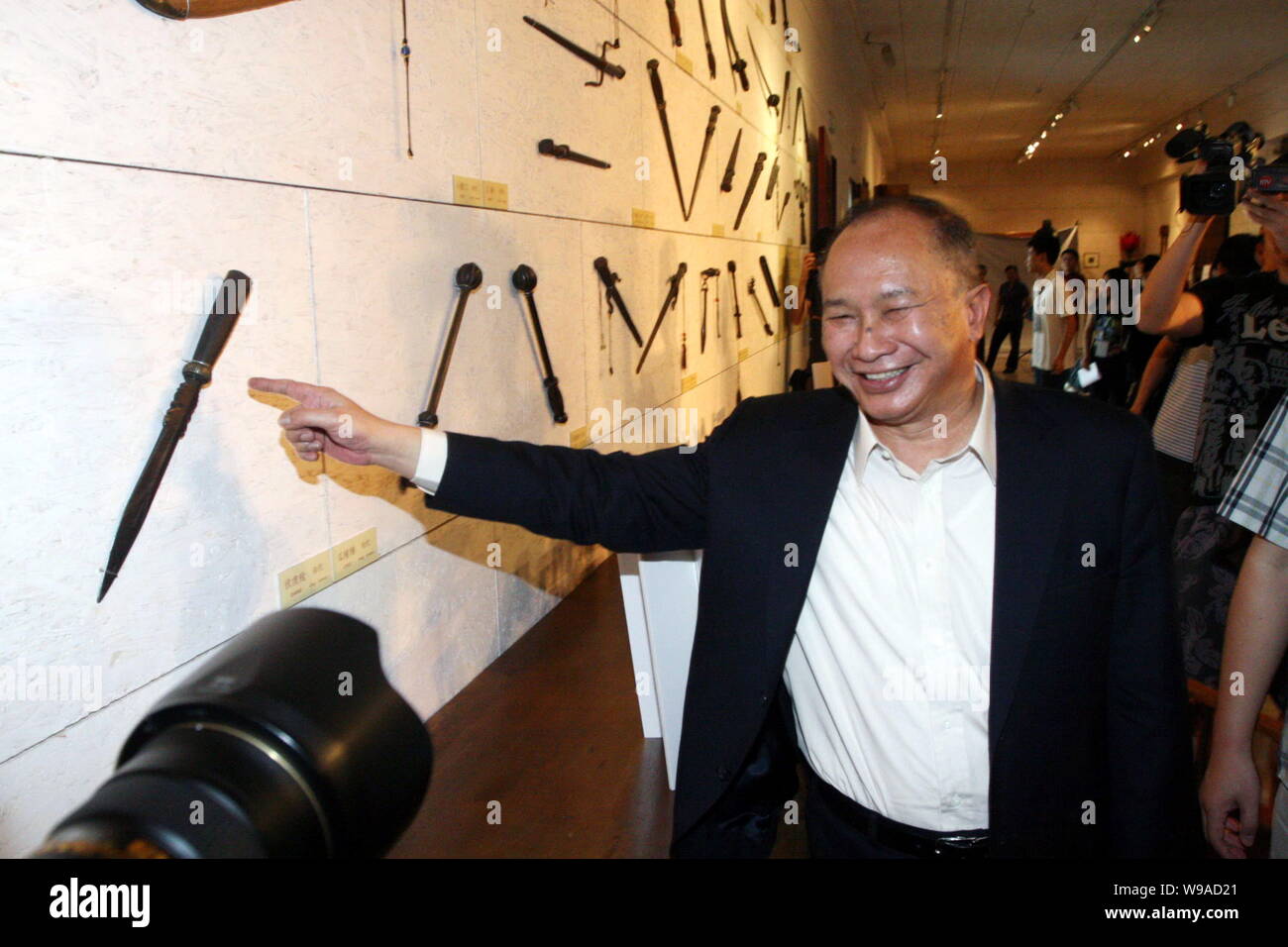 Hong Kong director John Woo looks at ancient weapons during a martial ...