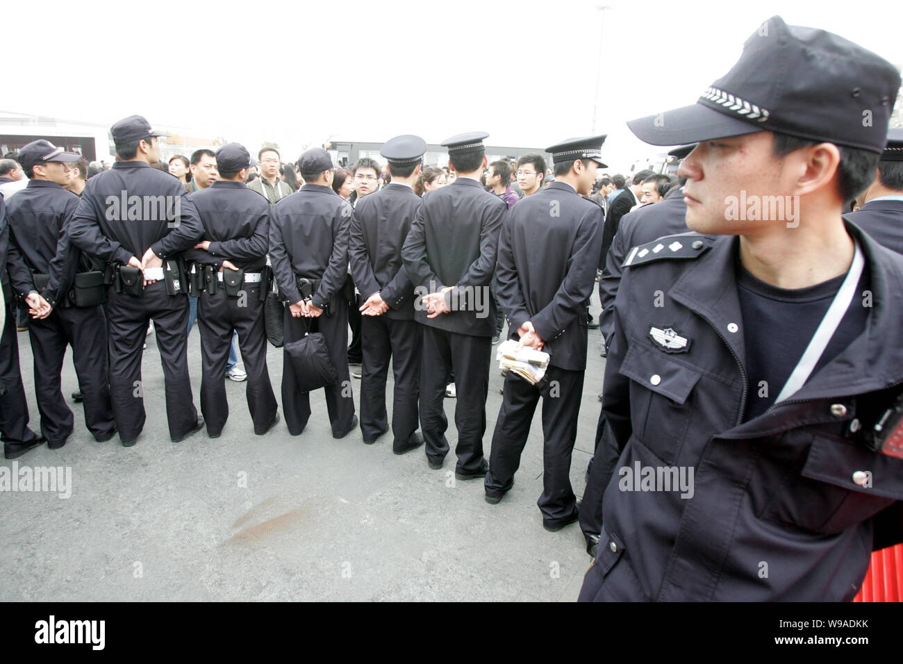 Chinese security guards stand guard in the Expo site in Shanghai, China ...