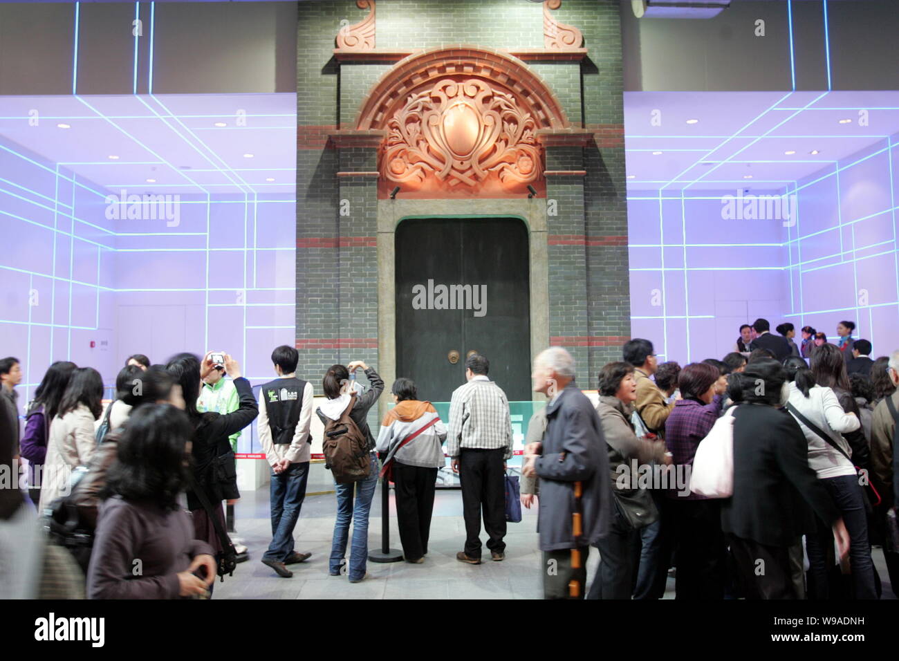 Visitors look at a shikumen-style installation inside the Shanghai ...