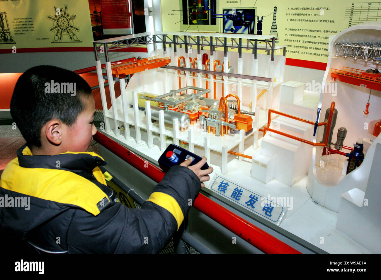 --FILE--A Chinese boy tries out a nuclear power simulator at the Wuhan ...