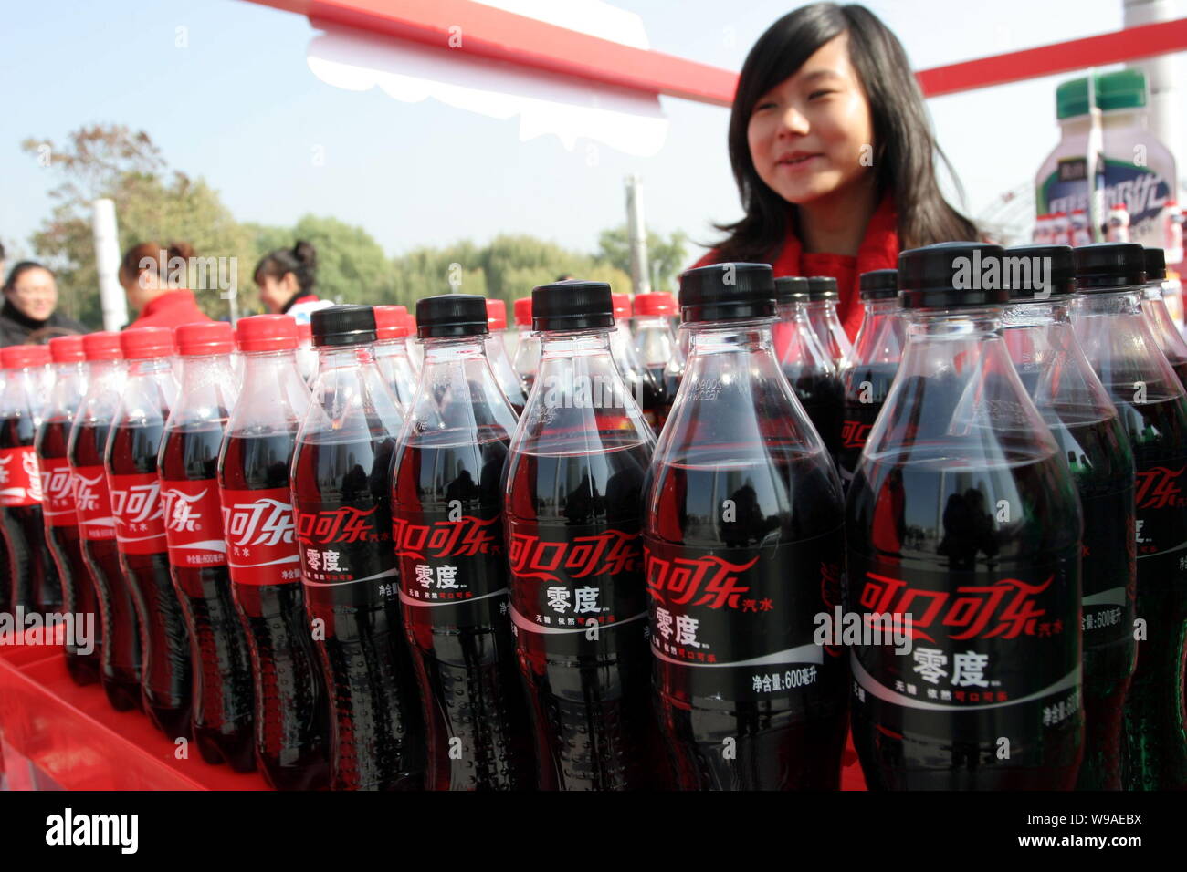 --FILE--Chinese girls distribute bottles of Coca-Cola coke during a ...