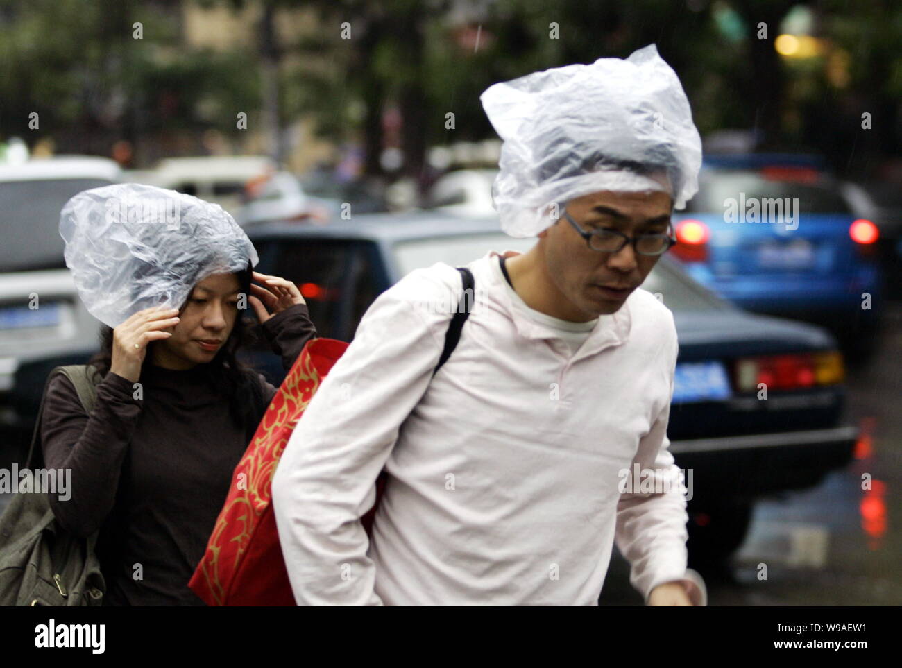 Wearing plastic bags hi-res stock photography and images - Alamy