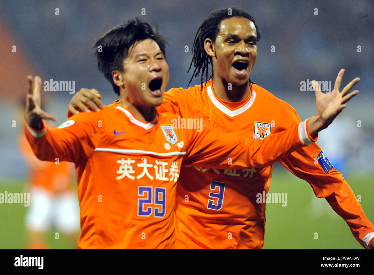 Li Jinyu, left, of Chinas Shandong Luneng FC celebrates with his ...