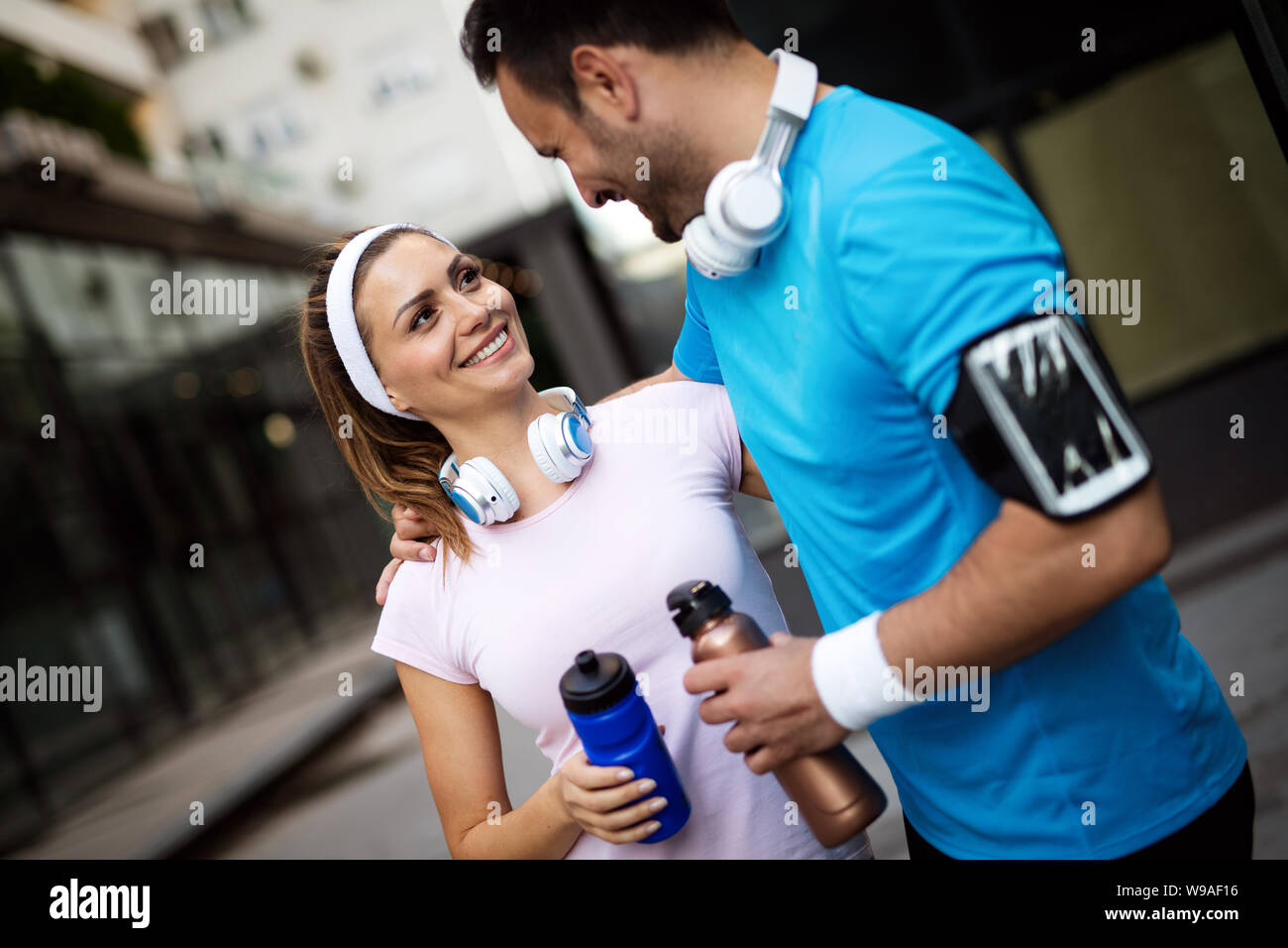 Fitness sporty couple relaxing after running training outside Stock ...