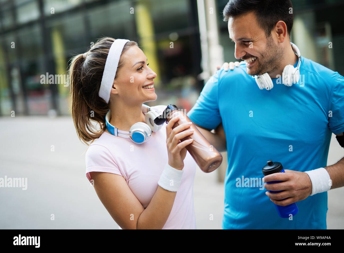 Fitness sporty couple relaxing after running training outside Stock ...
