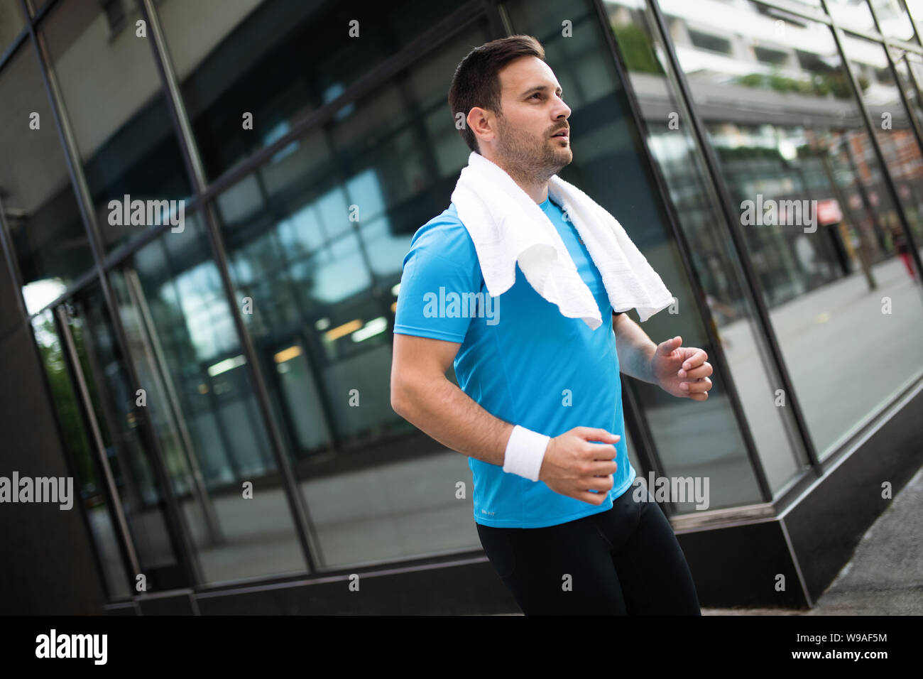 Handsome man running in sunset hi-res stock photography and images - Alamy