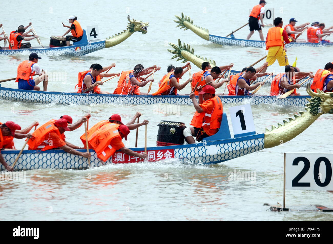 Chinese participants compete during a dragon boat racing to celebrate ...