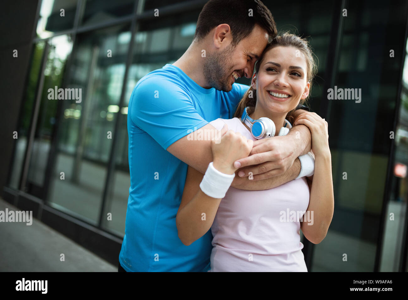 Fitness sporty couple relaxing after running training outside Stock Photo - Alamy