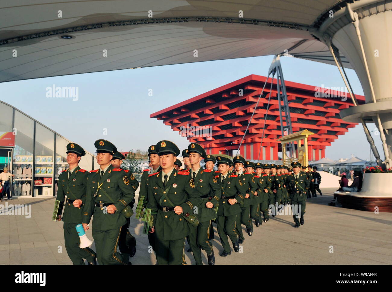 Chinese paramilitary soldiers patrol the Expo site in Shanghai, China ...
