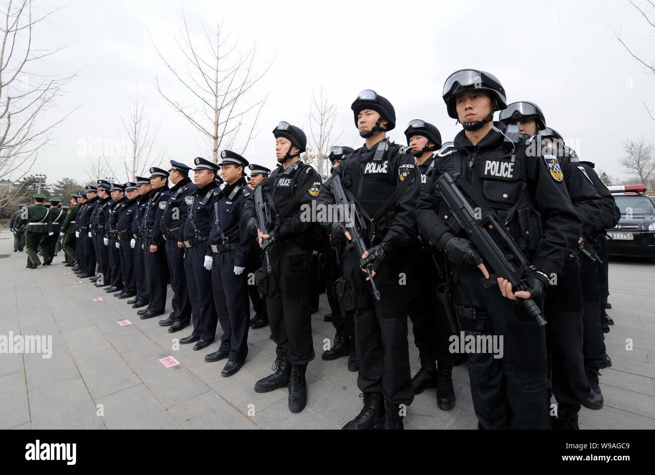 Armed Chinese policemen prepare to patrol the city center in Beijing ...