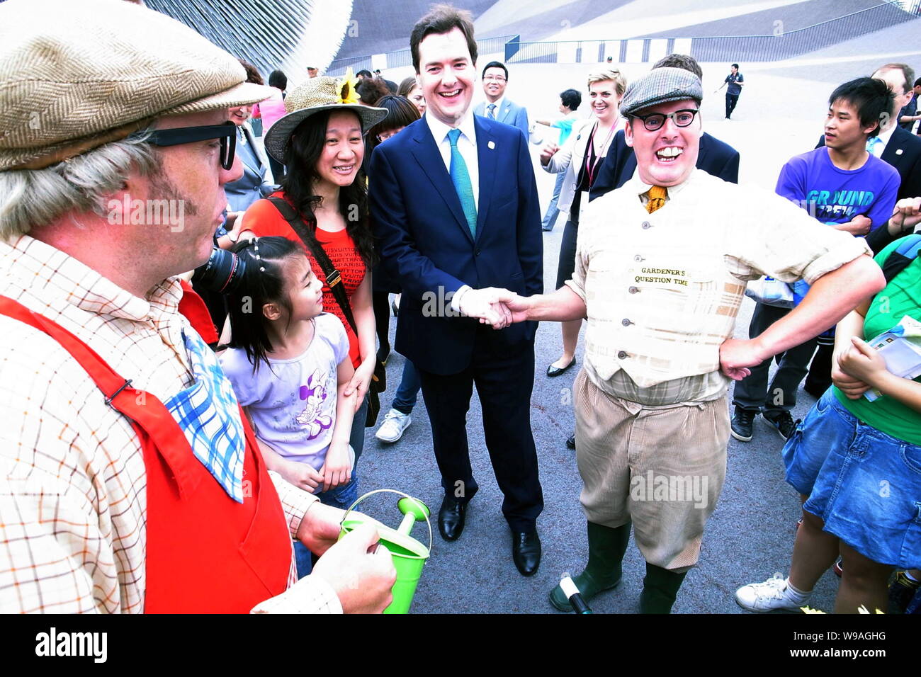 British Chancellor of the Exchequer George Osborne shakes hands with ...