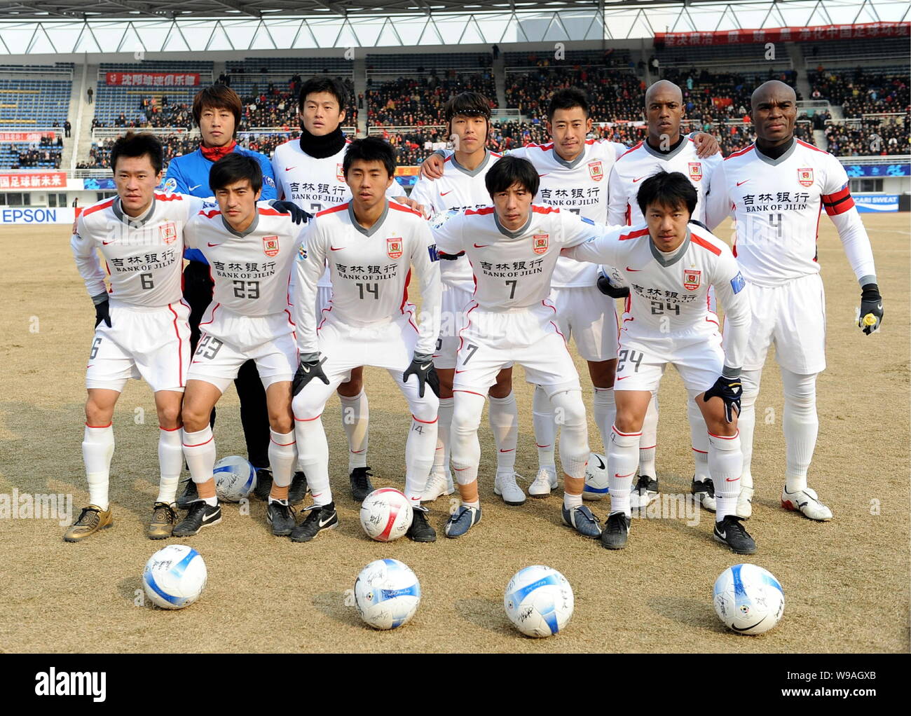 Players of Chinas Changchun Yatai FC pose for photos before competing ...