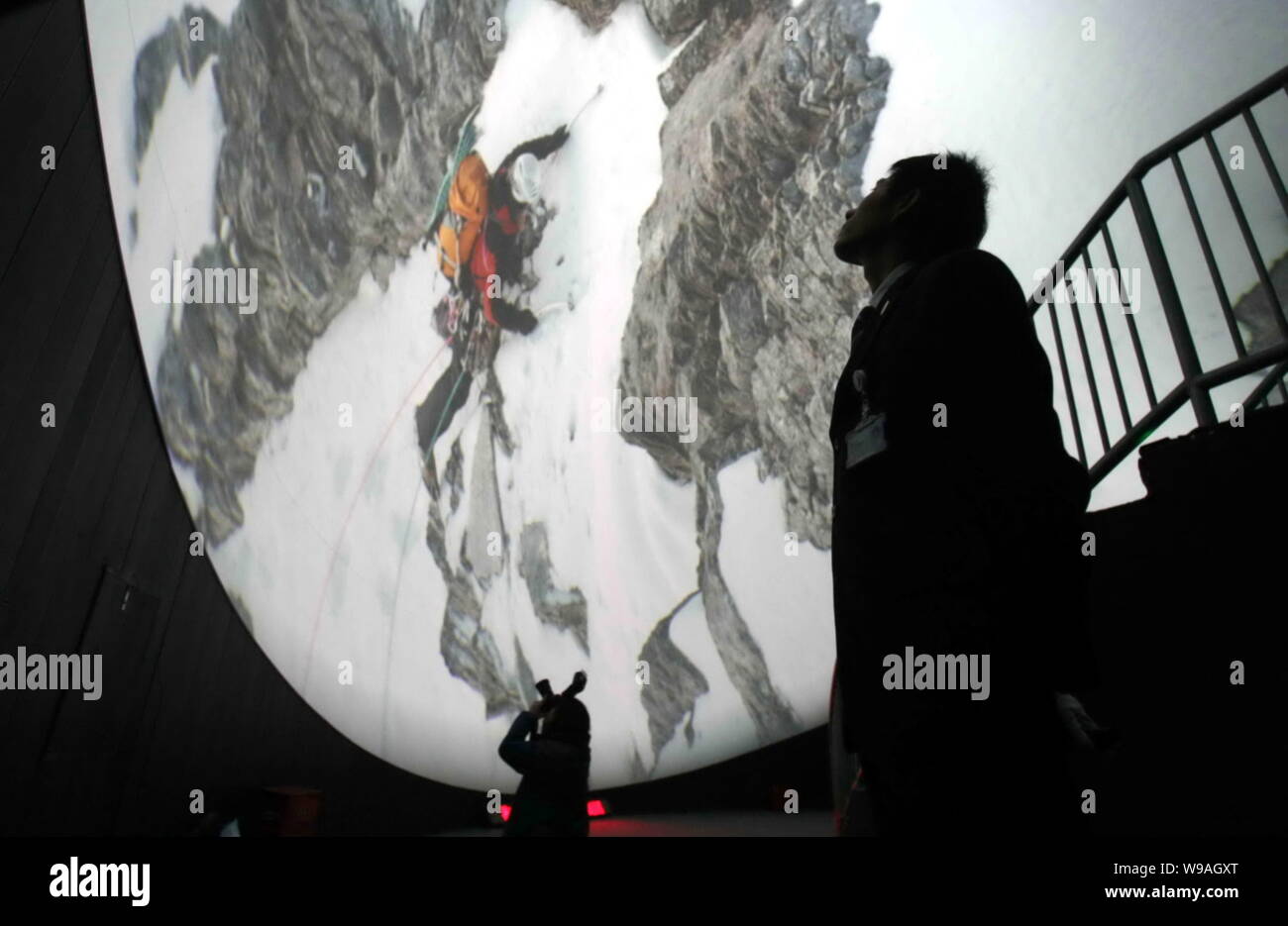 A staff and visitors watch the worlds biggest IMAX screen at the new ...