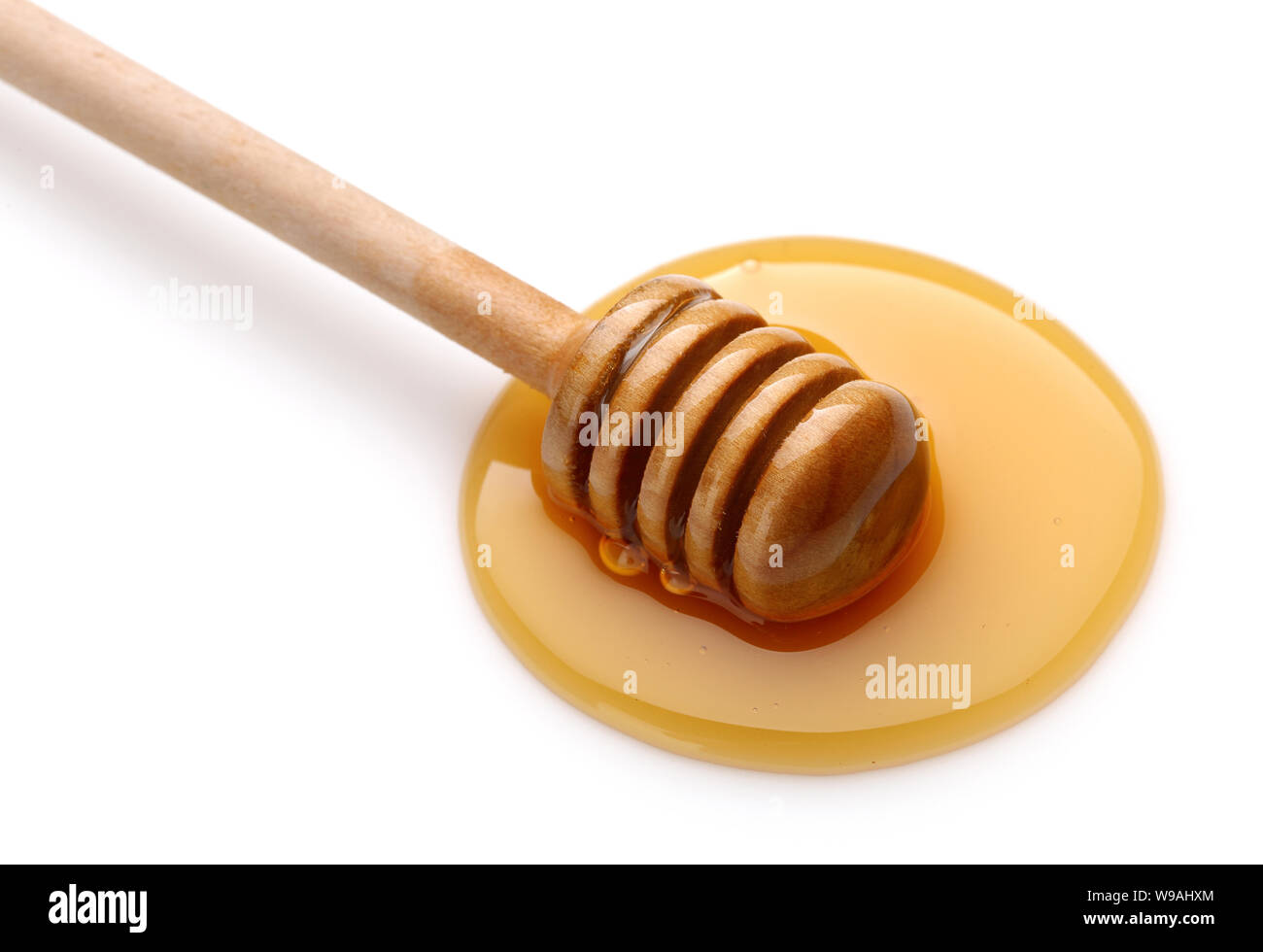 Wooden stick in the honey puddle isolated on white background Stock ...