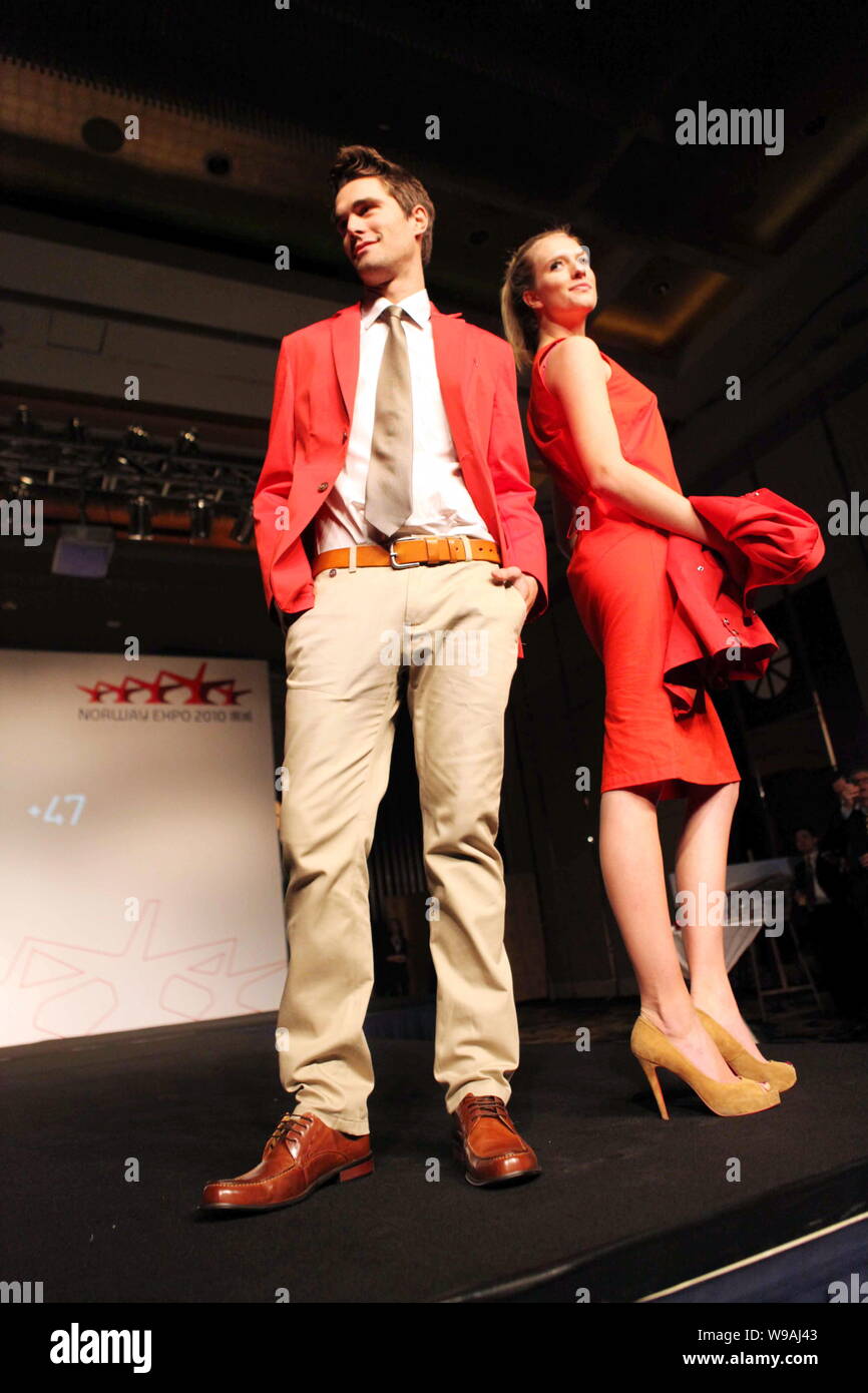 Models pose to show uniforms for employees of the Norway Pavilion for ...