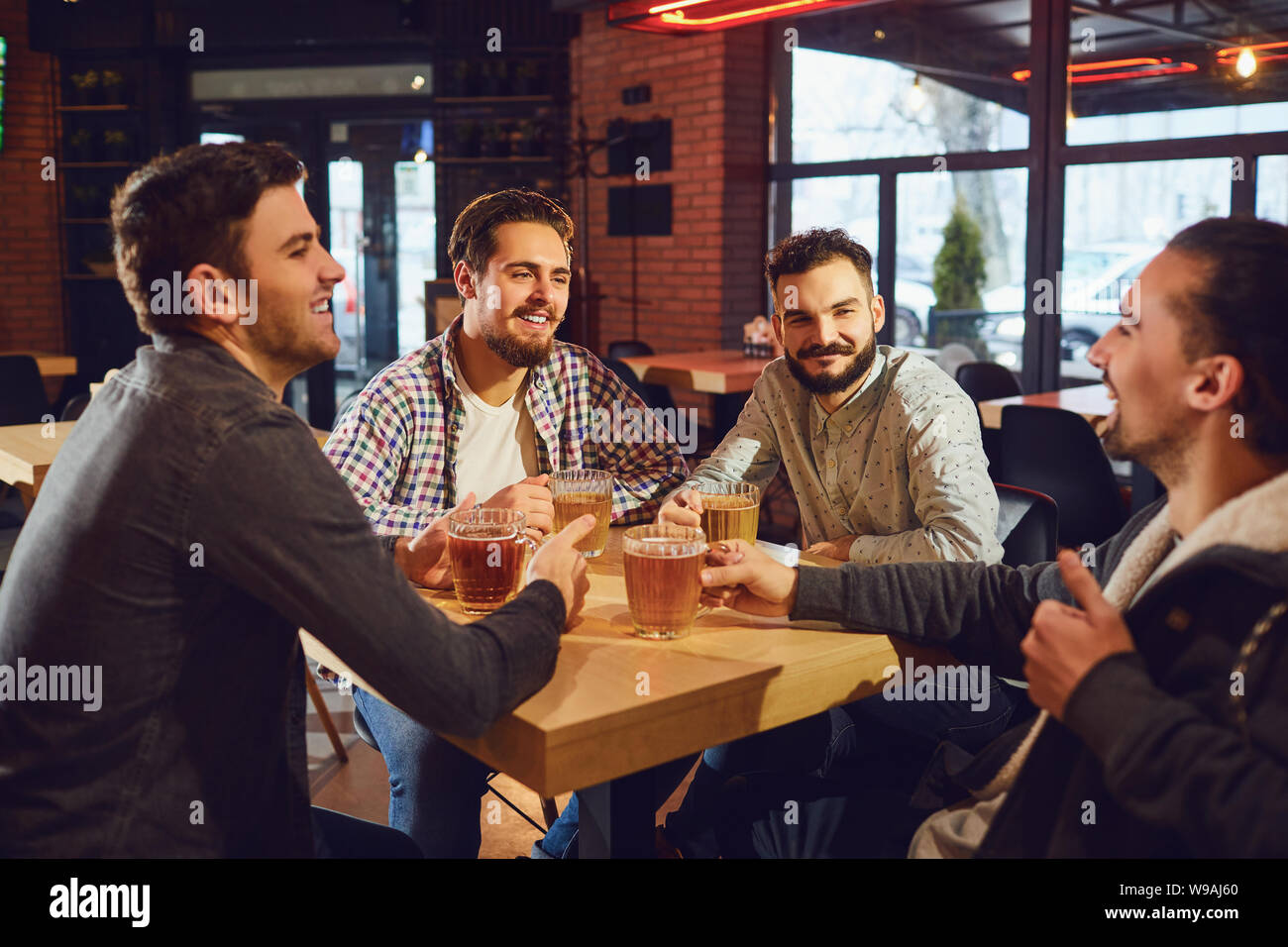 Young people in a meeting in a pub Stock Photo - Alamy