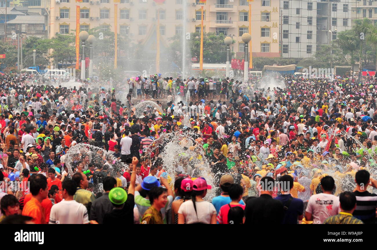 Chinese people splash water in a big fountain to save water during a ...