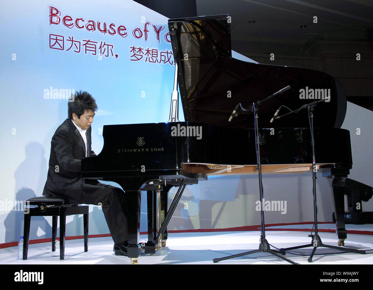 Chinese pianist Lang Lang performs during a charity auction banquet of ...