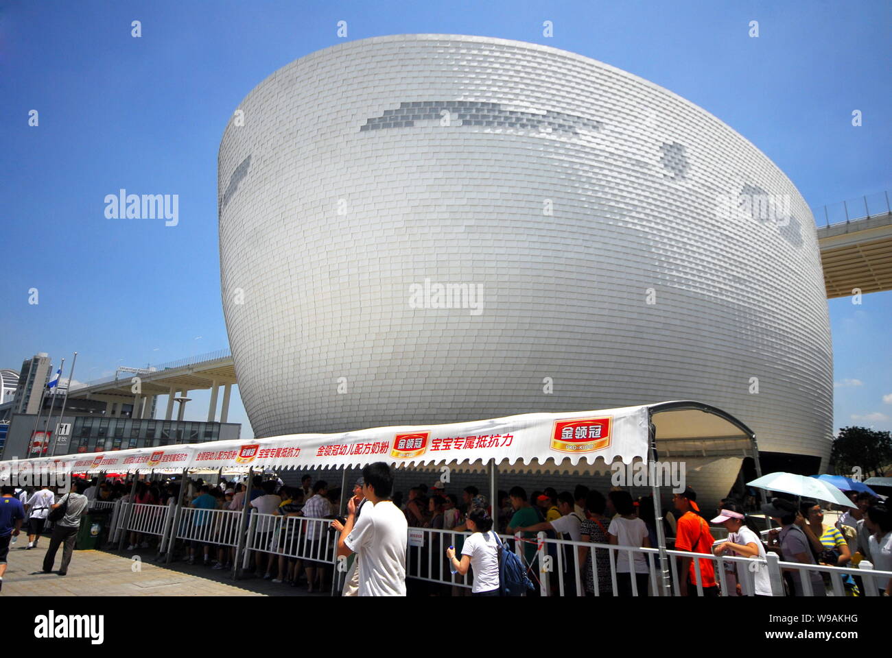 Crowds of visitors queue up to enter the Finland Pavilion in the World ...