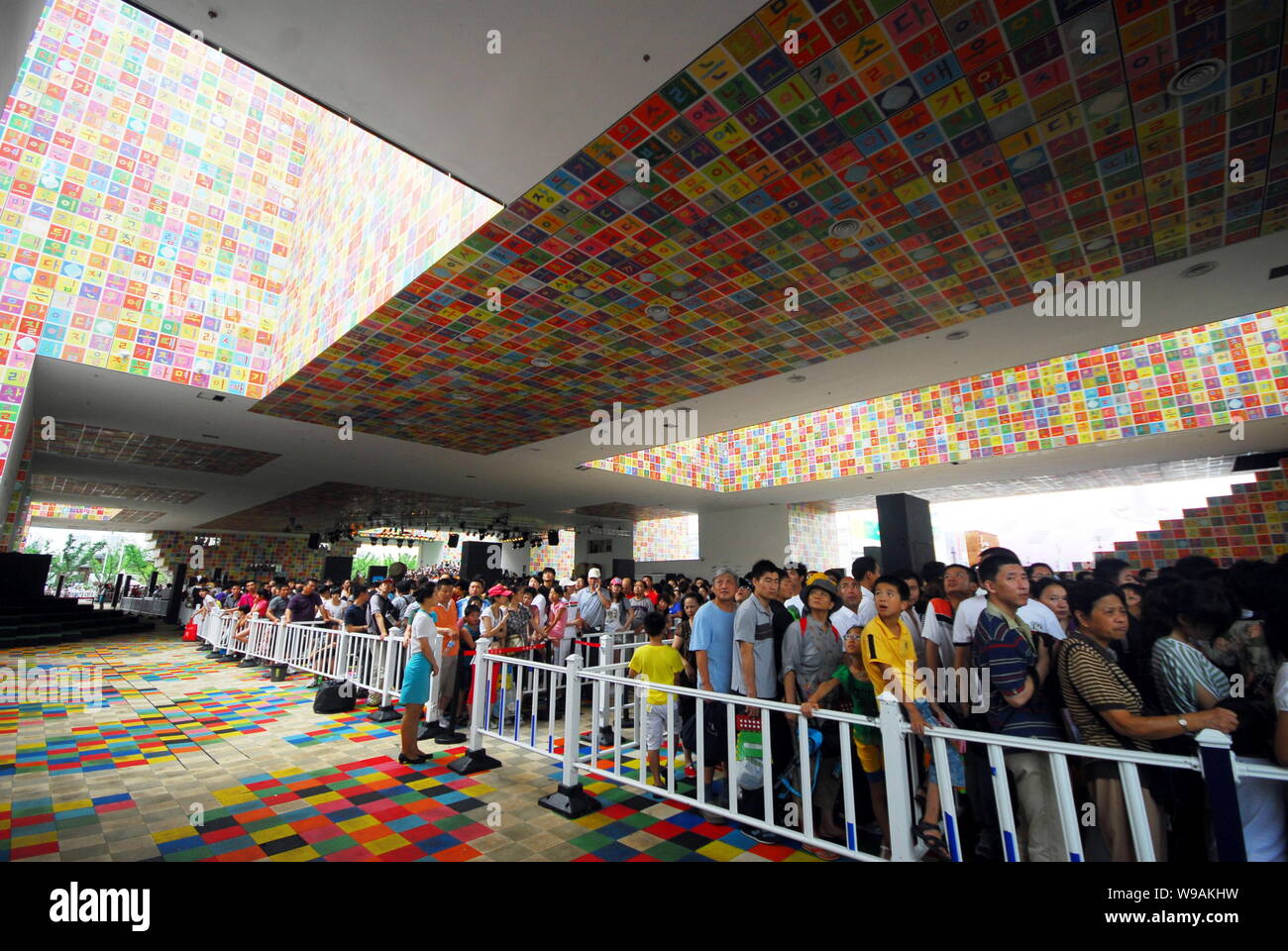 Crowds of visitors queue up to enter the Republic of Korea Pavilion in ...